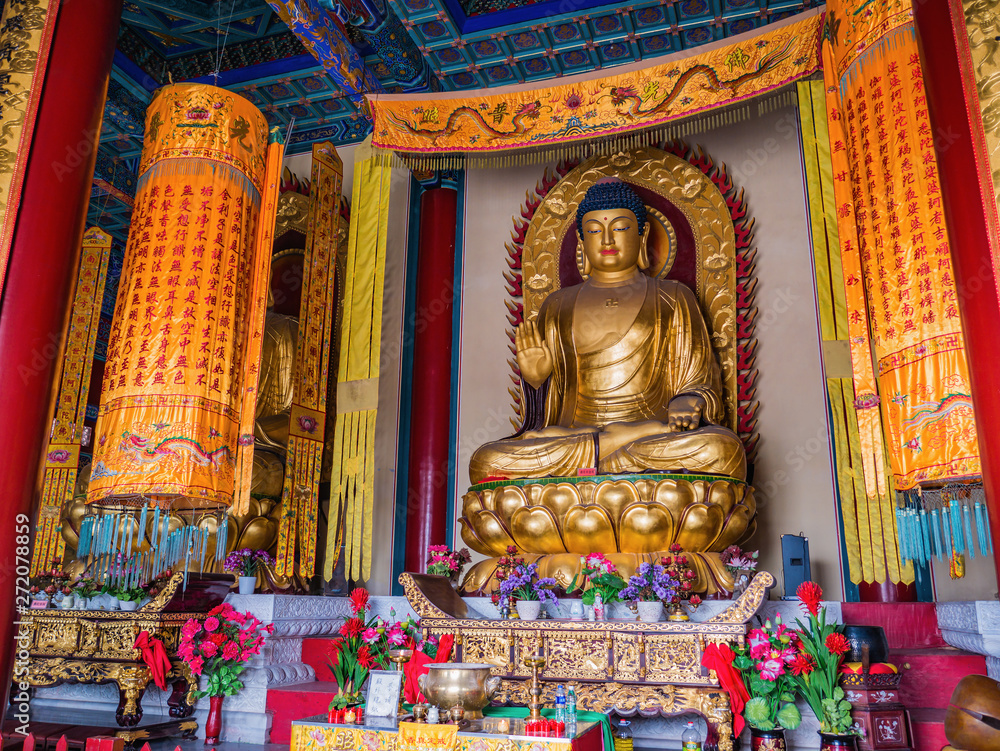 Golden buddha statue in Tianmen Temple Hall on tianmen mountain ...