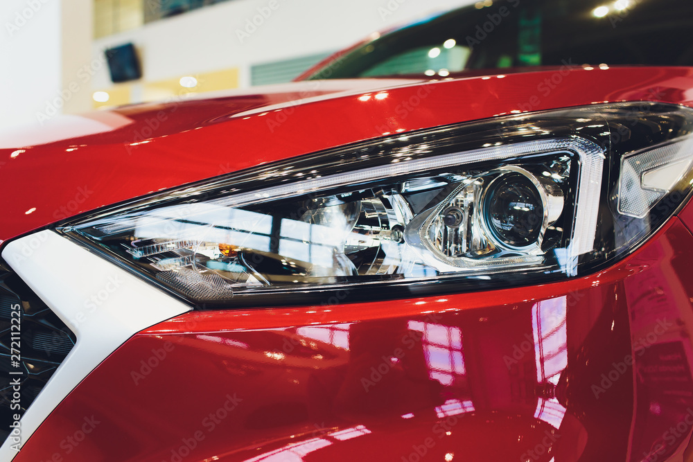 Close up of headlight detail of modern luxury car with projector lens ...