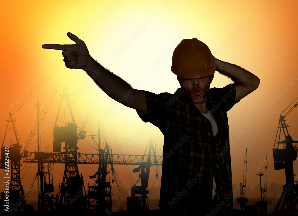silhouette of workman dancing happy emulating with hard hat pop star ...