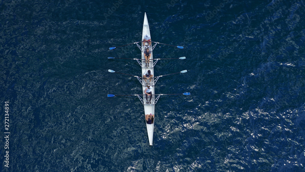Aerial drone bird's eye view of sport canoe operated by team of young ...