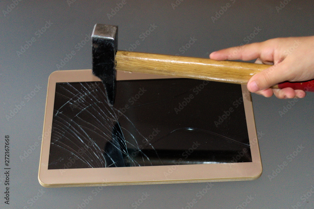 Breaking the screen of a tablet Stock Photo | Adobe Stock