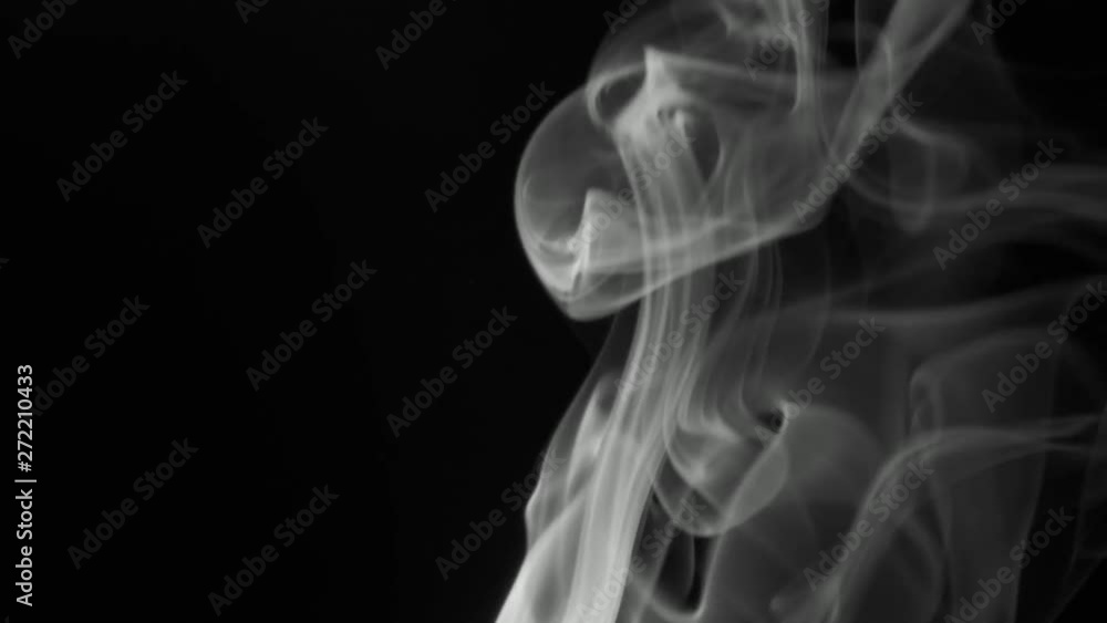Vidéo Stock Gray smoke rising graceful twists upward. Black and white ...