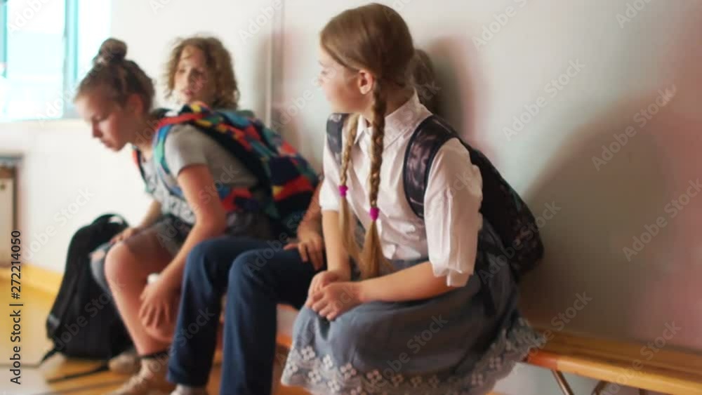 Back to school. Classmates greet and communicate during a school break ...