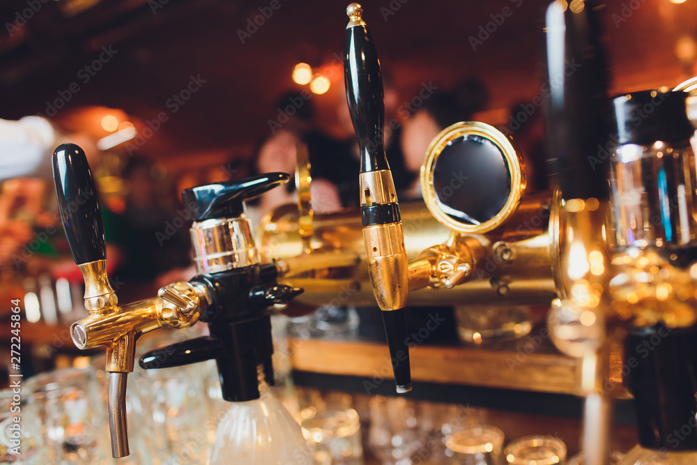 The beer taps in a pub. nobody. Selective focus. Alcohol concept ...