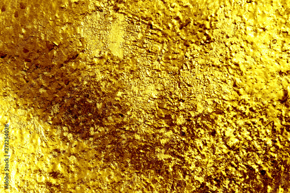 Texture of a surface of a golden nugget close-up for a background ...