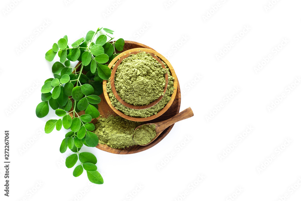 Moringa powder (Moringa Oleifera) in wooden bowl with original fresh ...