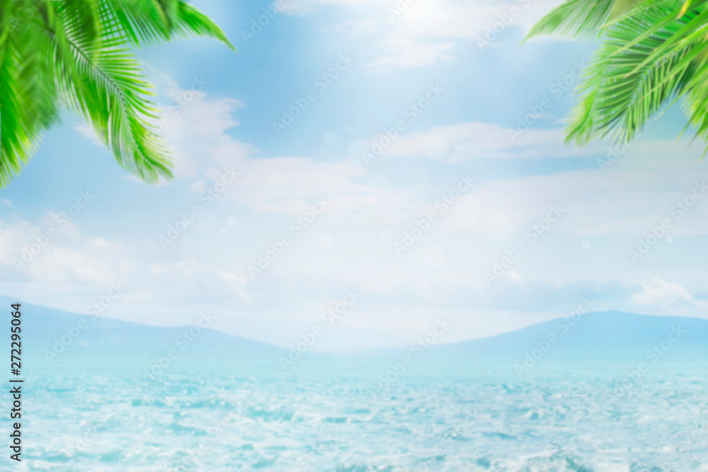 Blurred summer natural marine tropical blue background with palm leaves ...