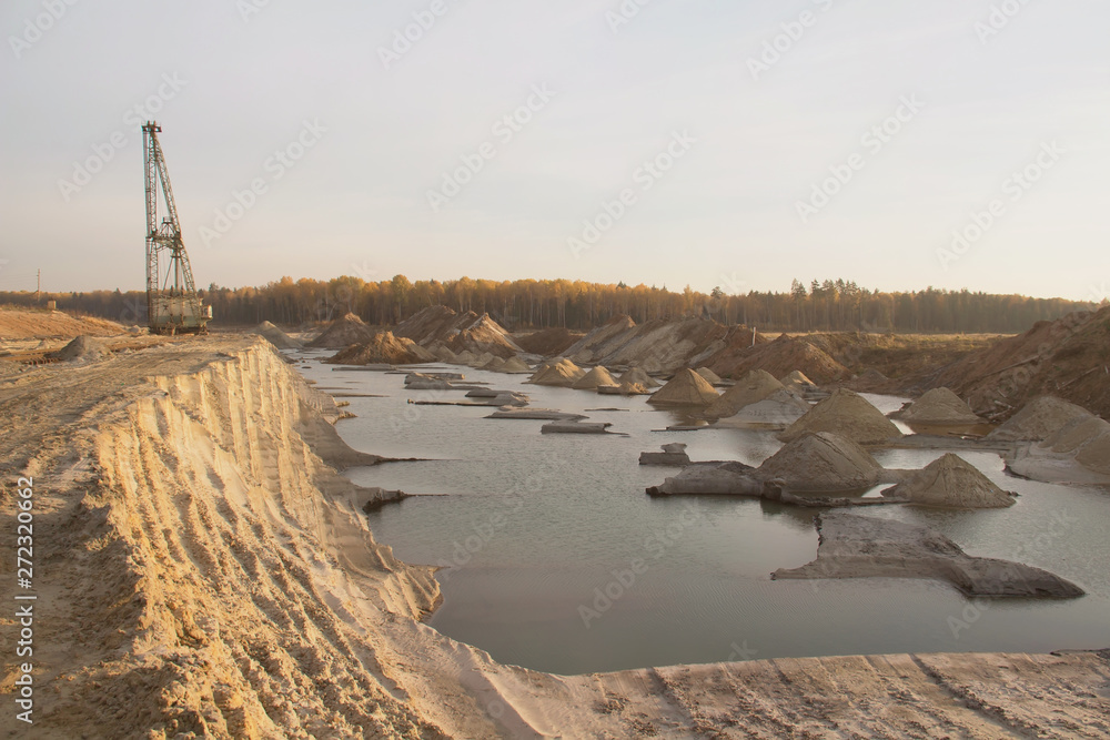 A dragline excavator in a sand quarry. Phosphorite Mine. Bulk material ...