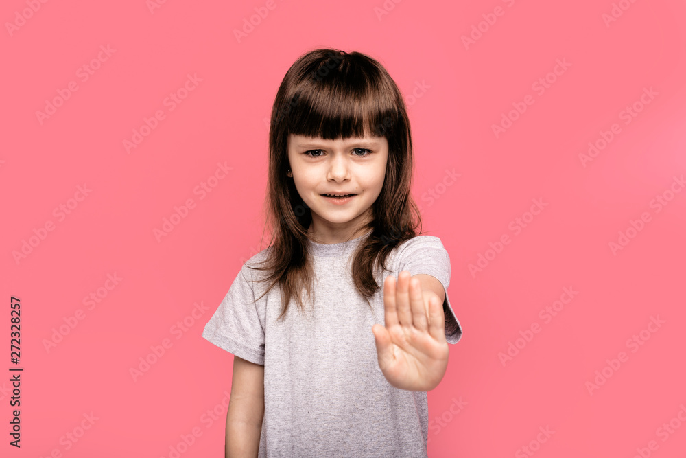 No violence, assault and war. Making stop gesture with her palm outward ...