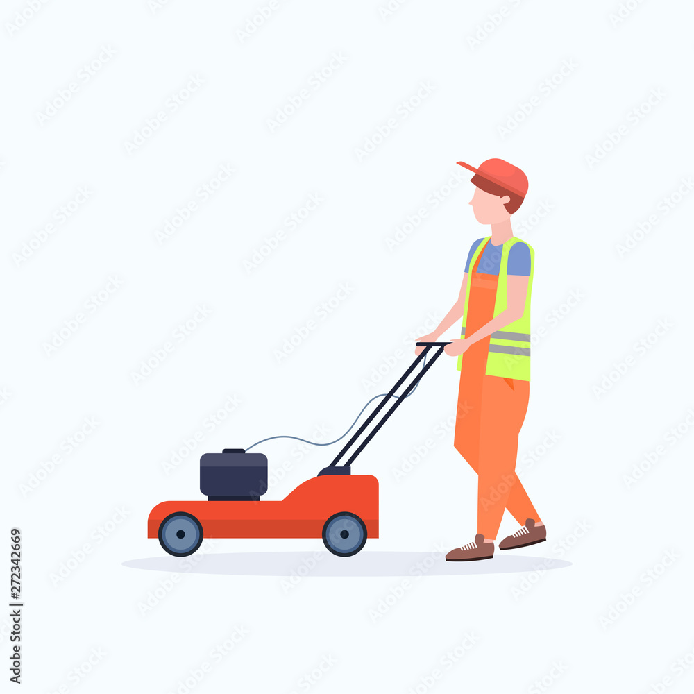 man gardener in uniform cutting grass with lawn mower gardening concept ...