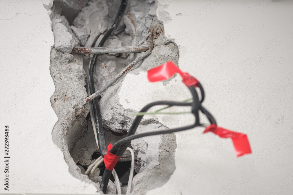 hole in the wall. bad wiring. insulation electricity. danger. Stock ...