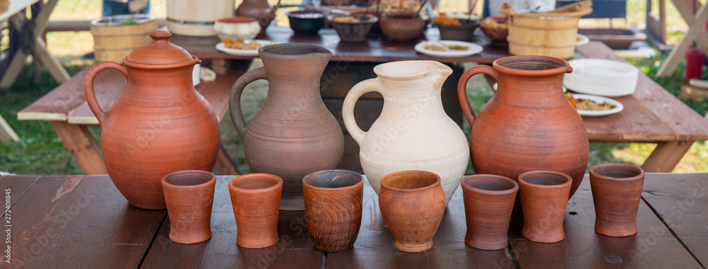 Handmade ceramic clay products. Jugs and glasses. Stock Photo | Adobe Stock