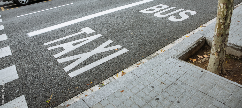 Taxi and bus stops on the road signs. Modern Spanish street. Stock ...