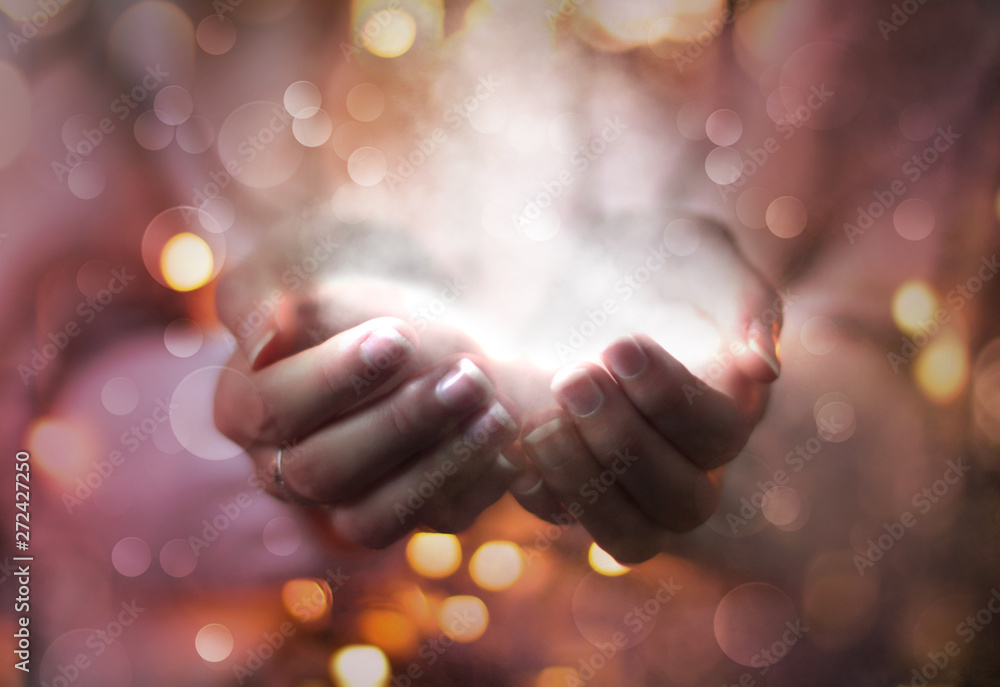 magic particles on the palms of a woman, the flow of magical energy ...