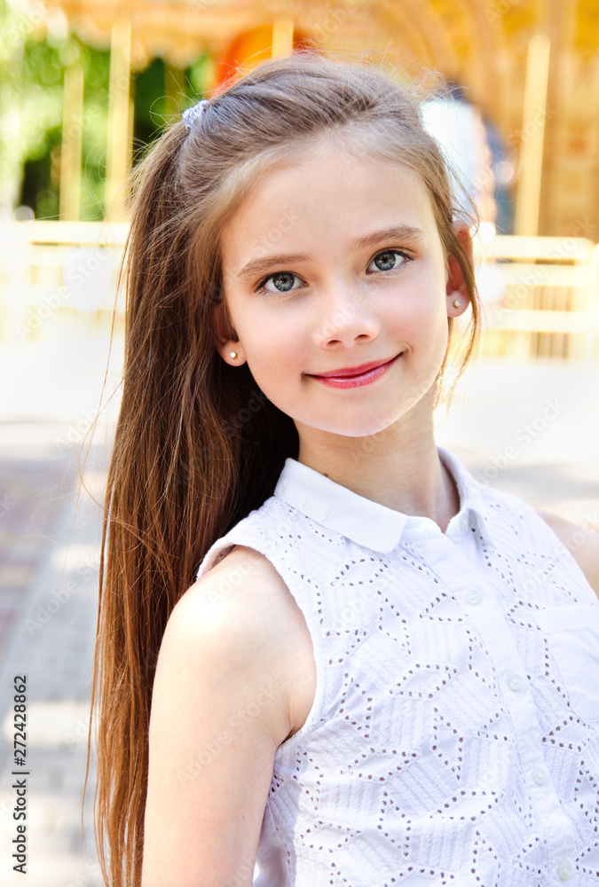 Portrait of adorable smiling little girl child schoolgirl teenager ...