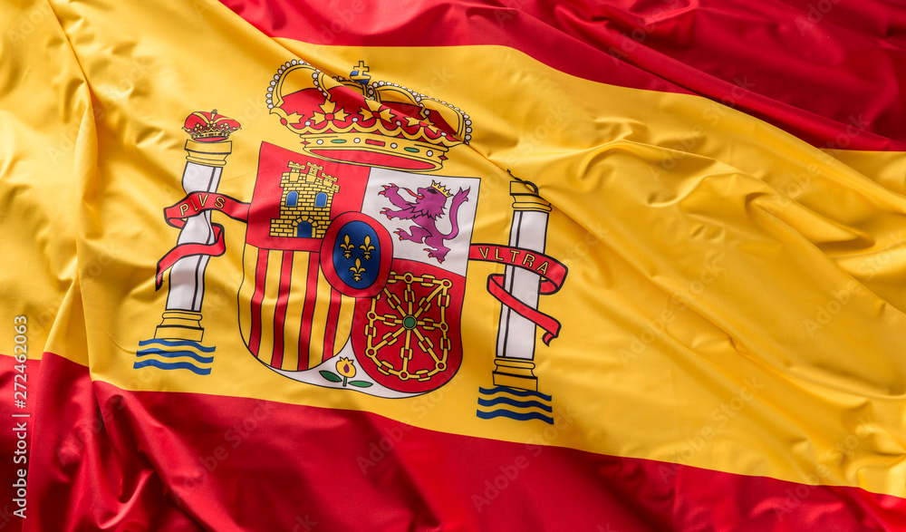 Spain flag of silk. Spanish national colours with emblem Stock Photo ...