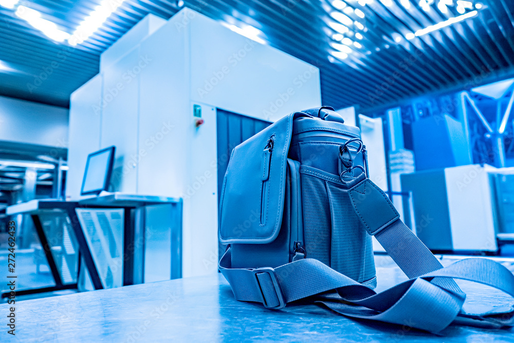 Airport. A bag on the baggage check conveyor belt. Pre-flight luggage ...