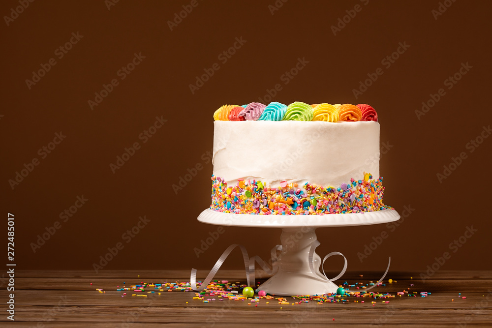 Birthday Cake with Rainbow Icing Stock Photo | Adobe Stock