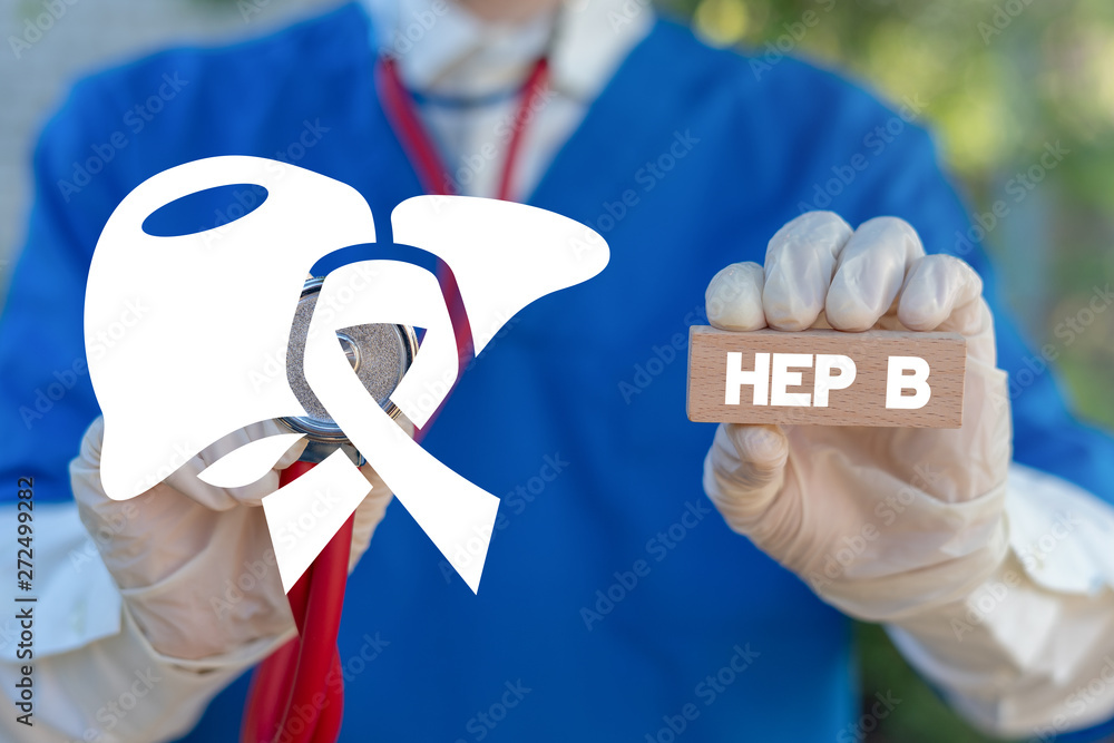Doctor holds wooden block with hep b text and touches liver hope ribbon ...