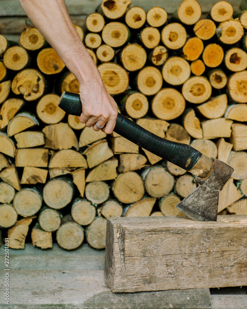 Hand holding axe Stock Photo | Adobe Stock