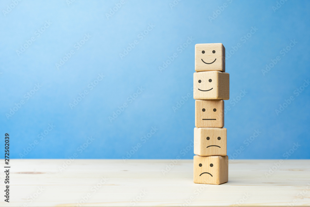Wooden blocks with the happy face smile face symbol on the table ...