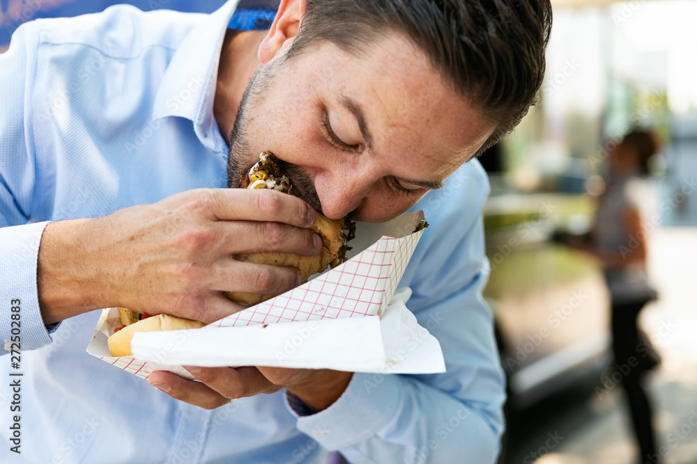 Food Truck: Customer Having A Hard Time Eating Large Sandwich Stock ...