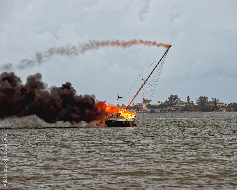 Sailboat on fire — Mast is falling Stock Photo | Adobe Stock