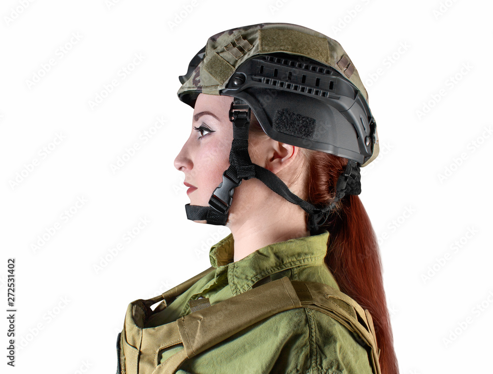Portrait of young and beautiful military soldier woman with red hair in ...