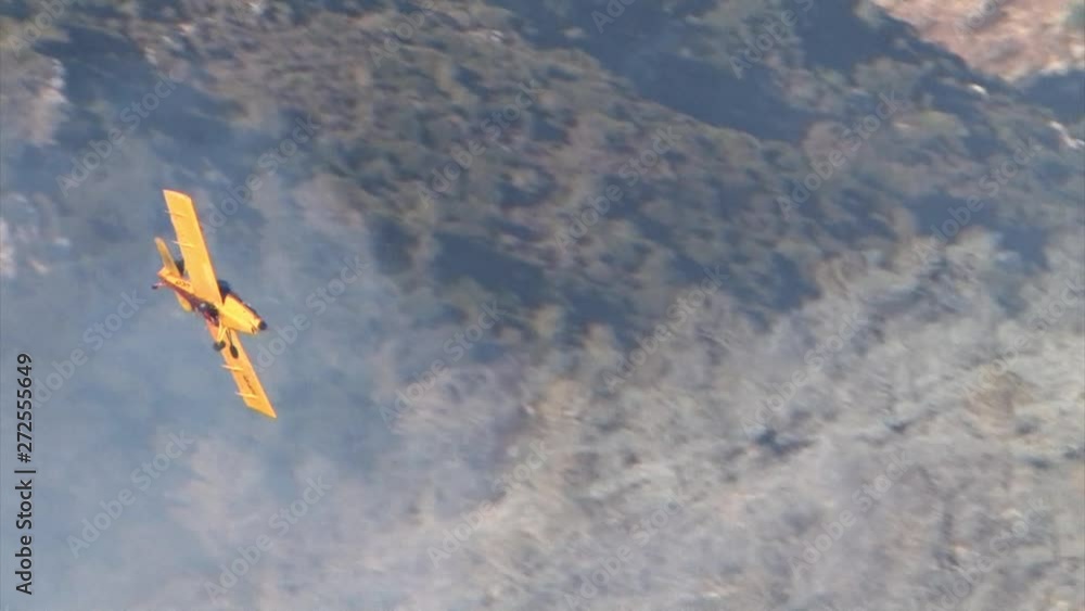 Fire fighting plane fly low and spray fire extinguisher on forest Fire ...