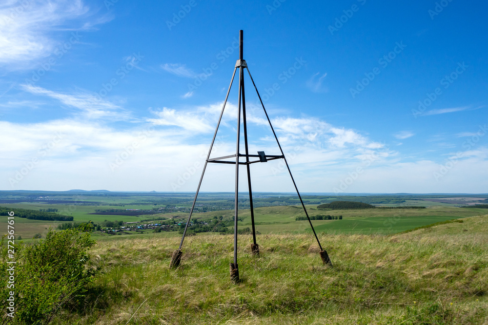 Metal tower on top of a hill. Geodesic, triangulation point. Beautiful ...