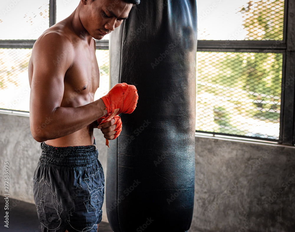 Man boxer wrapping his hand in boxing arena sport. Stock Photo | Adobe ...