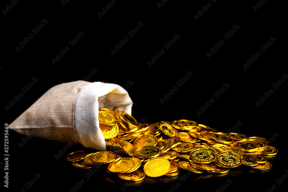 Stacking gold coin in treasure sack on black background Stock Photo ...