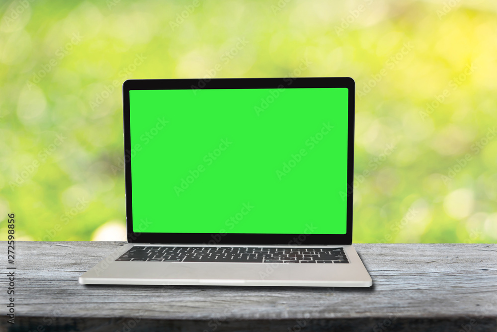 Green screen laptop with sunny abstract green nature background with ...