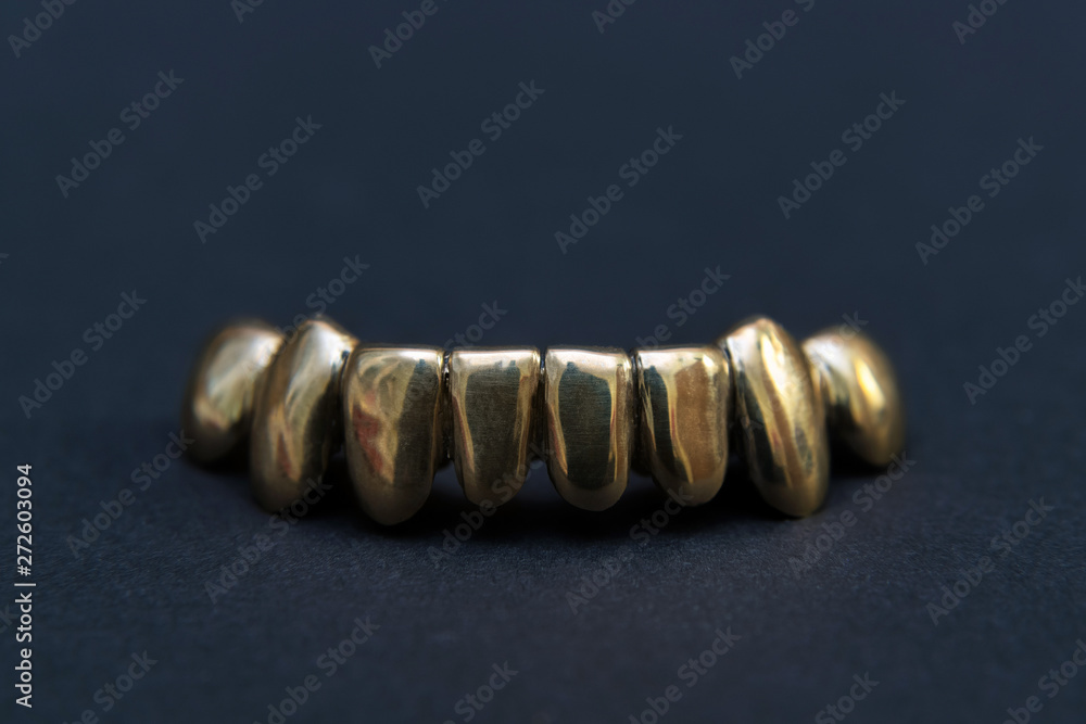 Golden teeth grillz on black background. Street culture gold jew Stock ...