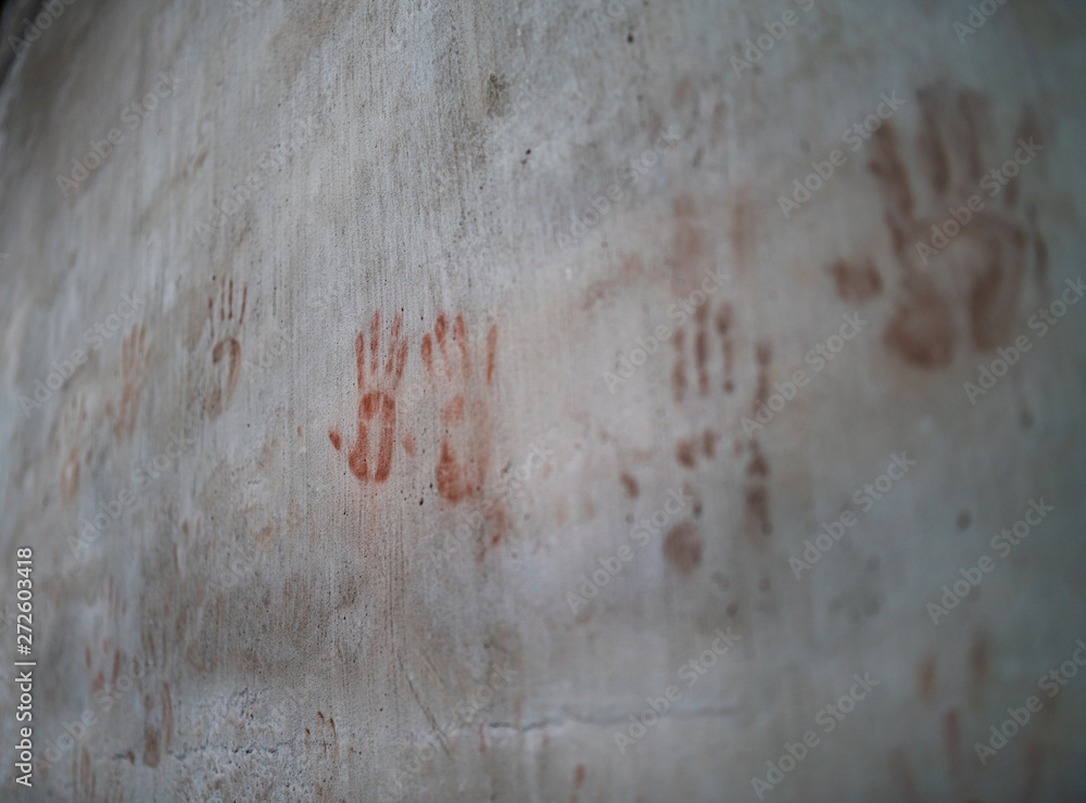Bloody red color hands on concrete wall texture Stock Photo | Adobe Stock