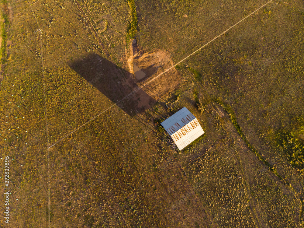 An aerial view of an old shed in the outback farmland of Googong NSW ...