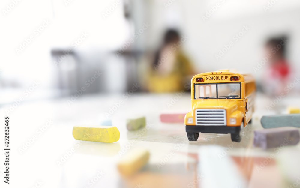 Yellow school bus toy model.Hi-key and very shallow depth of field ...