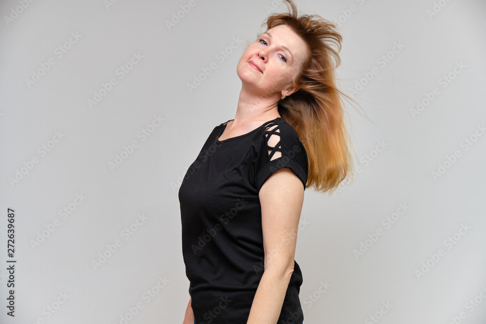 Studio portrait of a beautiful pretty woman aged 40 years on a white ...