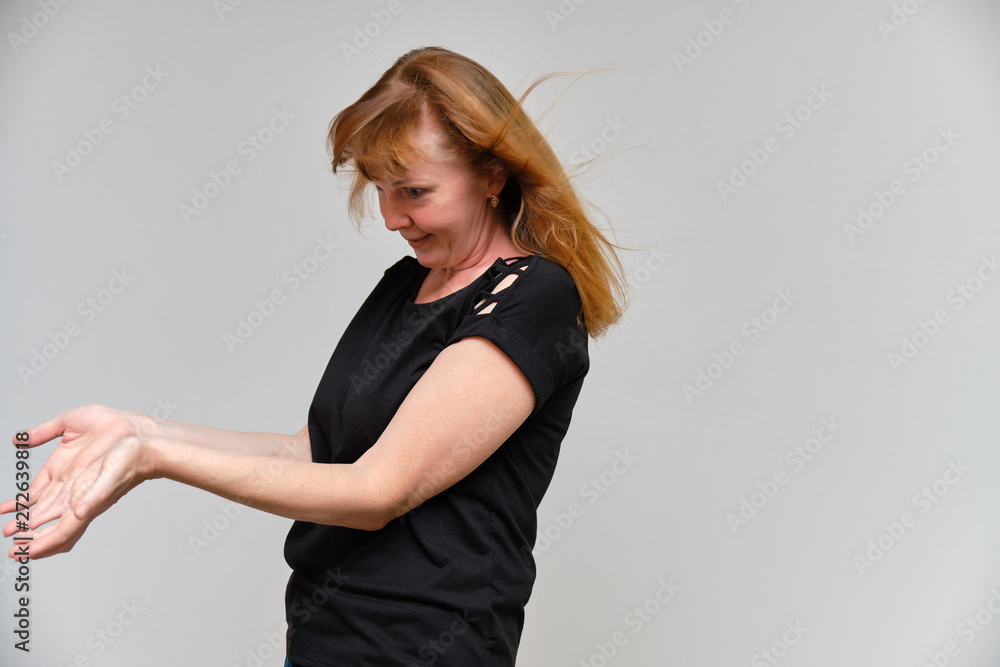 Studio portrait of a beautiful pretty woman aged 40 years on a white ...
