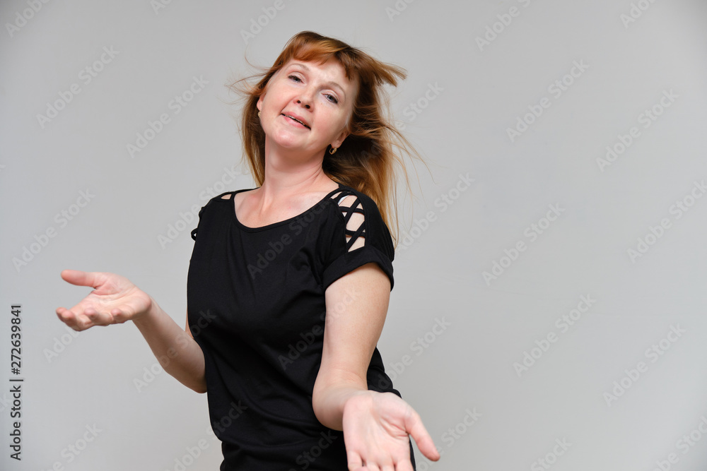 Studio portrait of a beautiful pretty woman aged 40 years on a white ...