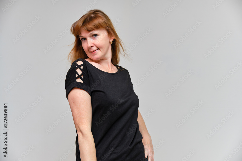 Studio portrait of a beautiful pretty woman aged 40 years on a white ...