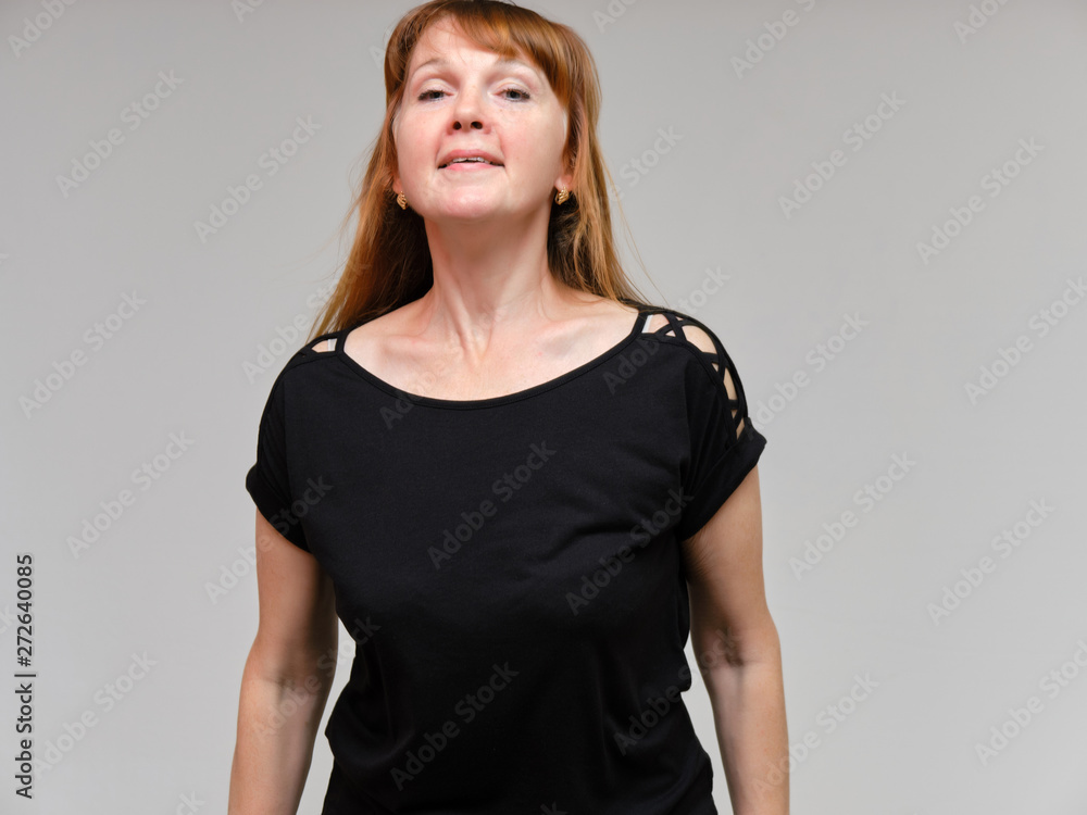 Studio portrait of a beautiful pretty woman aged 40 years on a white ...