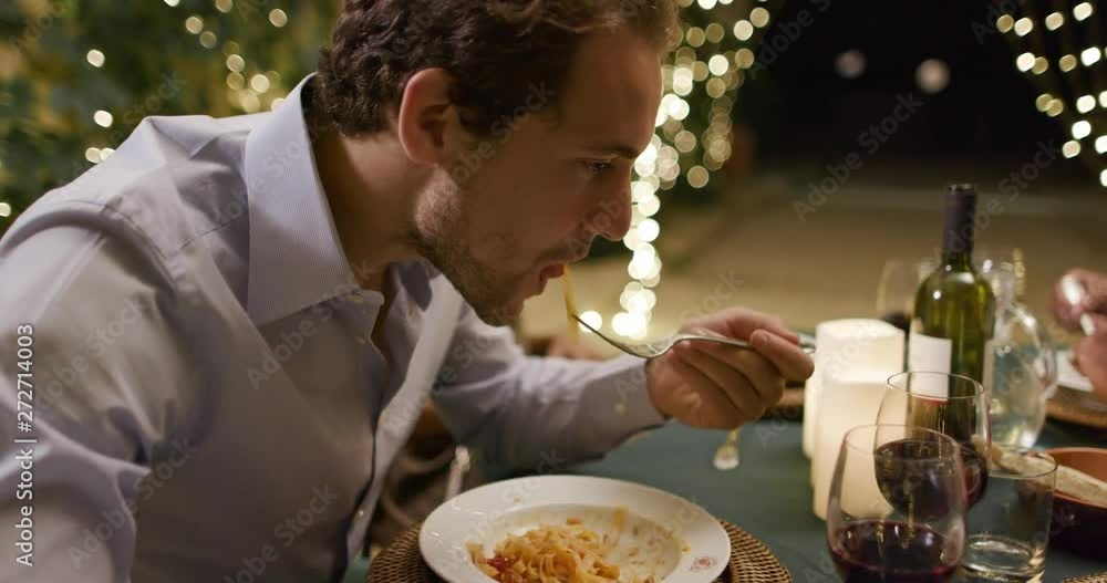 Man hands detail while eating using fork during a romantic gourmet ...