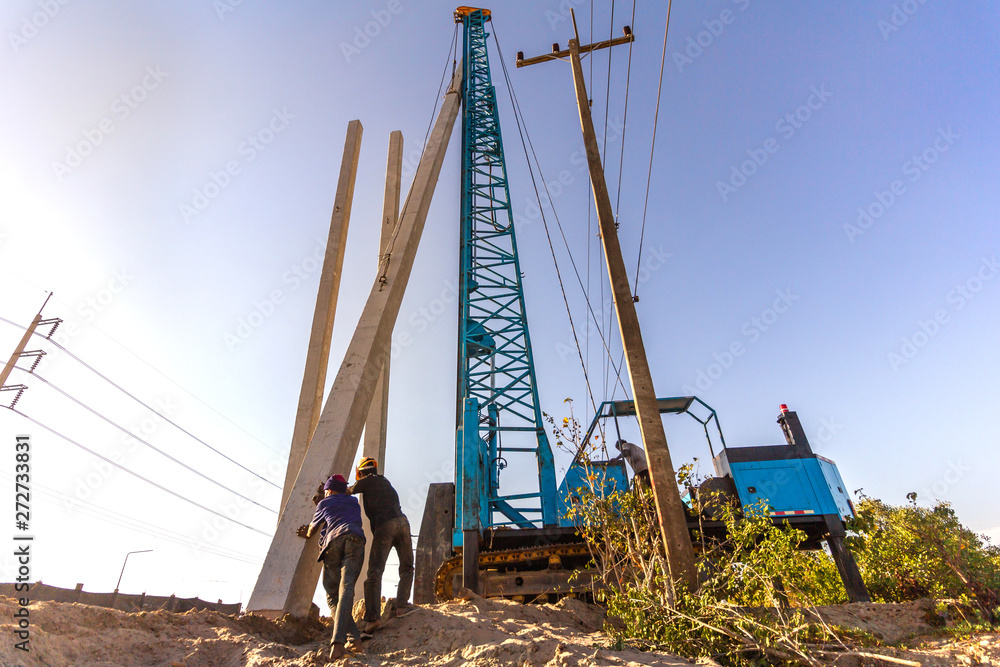 Pile driving working at construction site. Hydraulic drilling machines ...