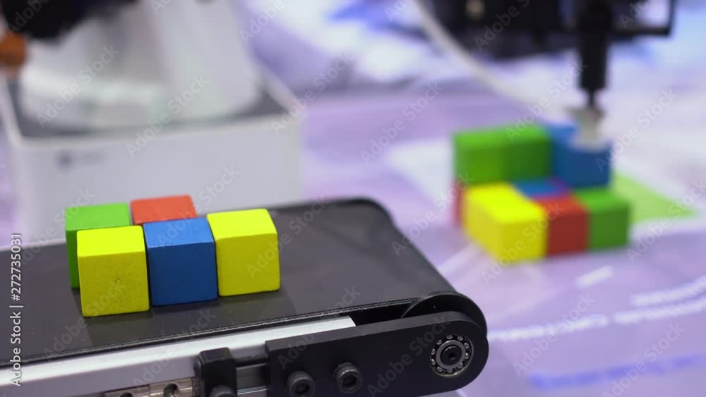 Colored Cube Objects Robotic Device Operation. Exposition Center ...