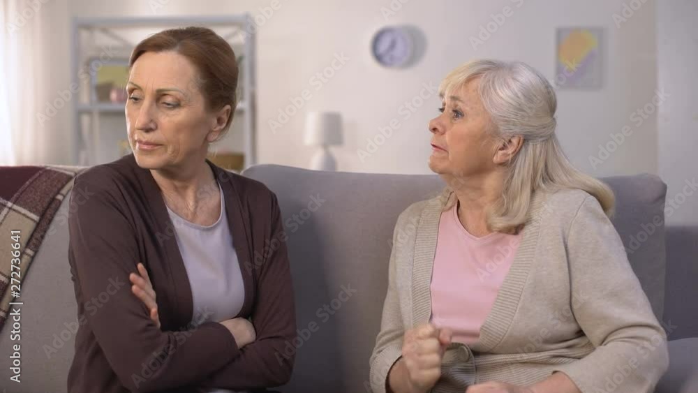 Self-assertive old women arguing and offending each other sitting in ...