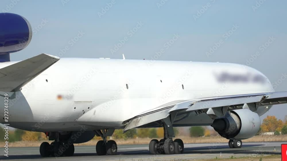 Commercial airplane aircraft moving and driving along runway at ...