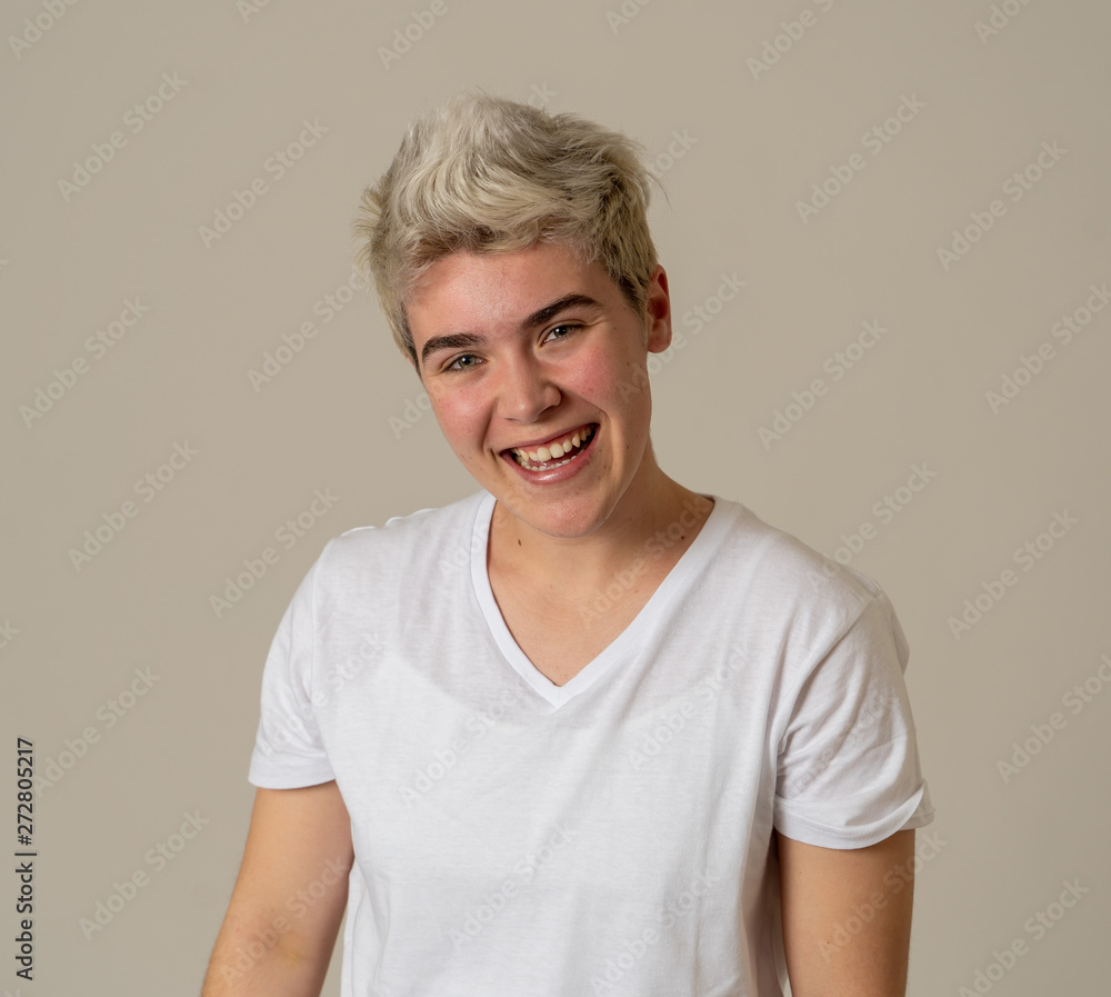 Portrait of attractive cheerful transgender young man with smiling ...