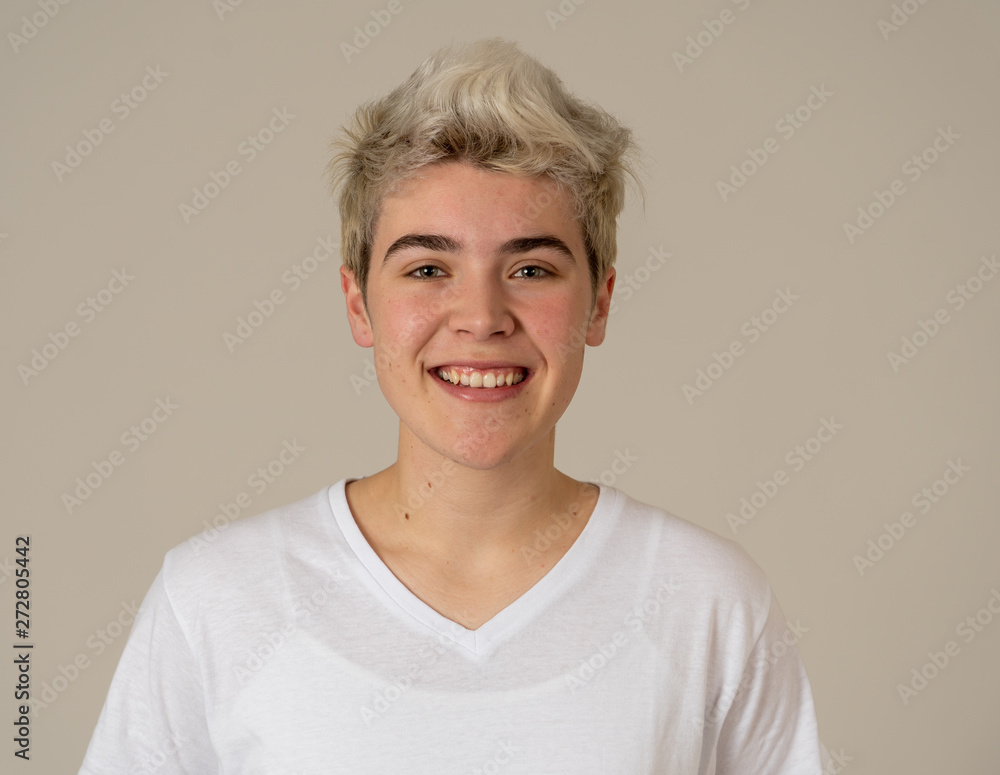 Portrait of attractive cheerful transgender young man with smiling ...