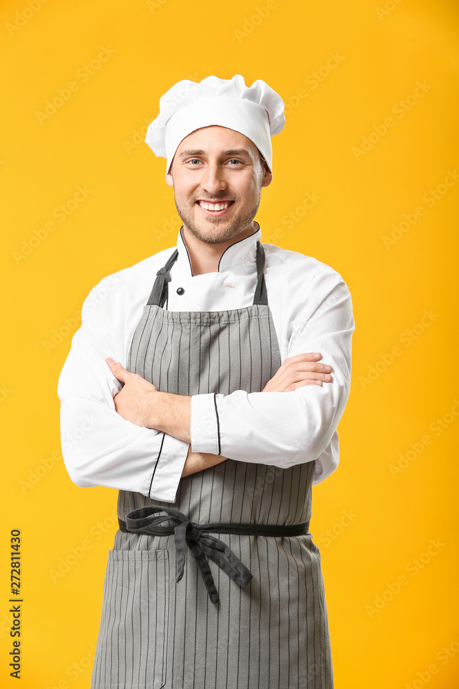 Handsome male chef on color background Stock Photo | Adobe Stock